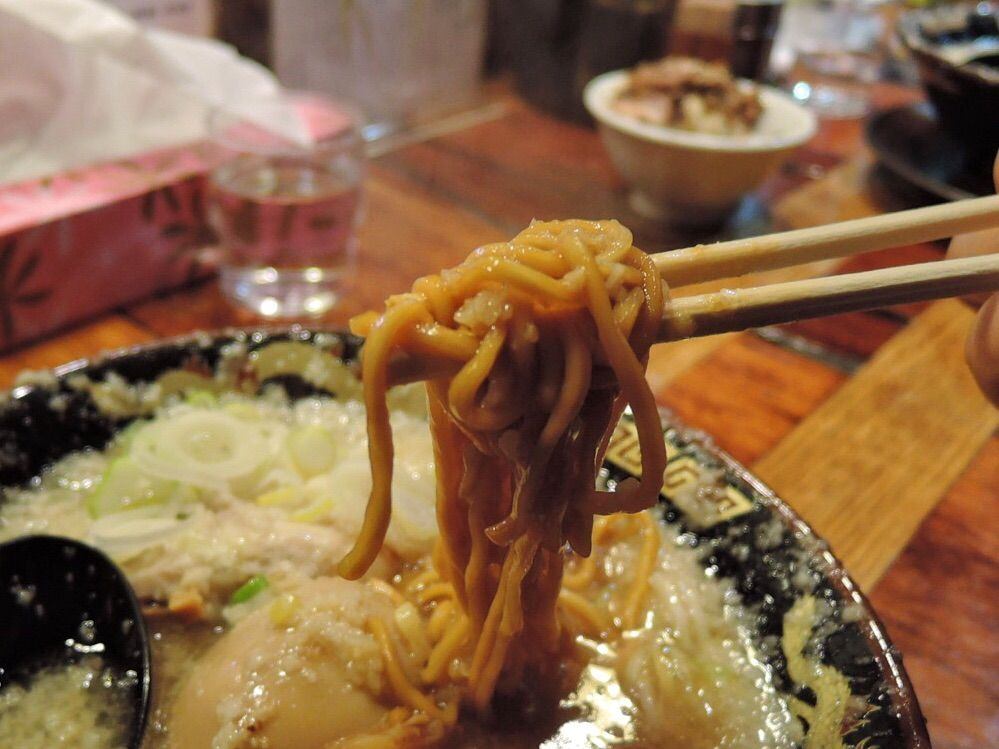 Kan-nana Ramen soup filled with seabura (pork back fat) that it almost ...